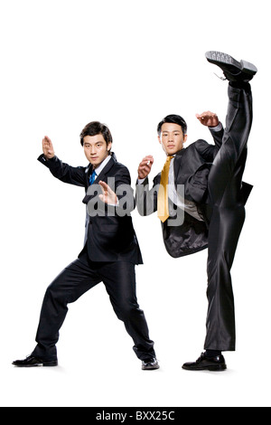 Two businessmen fighting on white background Stock Photo - Alamy