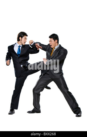Two businessmen fighting on white background Stock Photo - Alamy