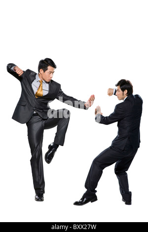 Two businessmen fighting on white background Stock Photo - Alamy