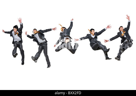 Five businessmen flipping in the air Stock Photo - Alamy