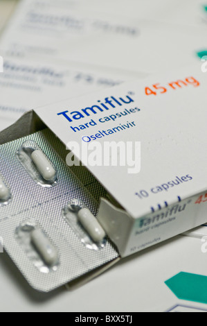Tamiflu medicine box with blister and capsules closeup with lots of ...