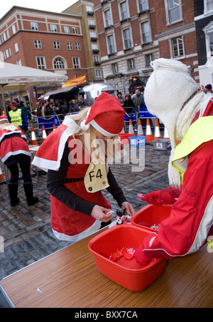 competitors assemble mr potato head fixture to there Christmas puddings ...