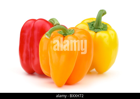 Red and yellow capsicum peppers isolated on a black background Stock ...