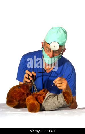 Surgeon by an doctor and a toy bear Stock Photo - Alamy
