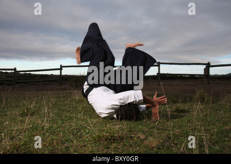 Man doing a karate roll Stock Photo - Alamy