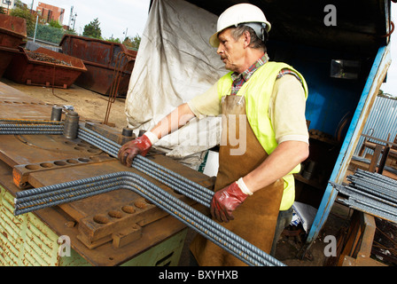 Equipment for bending steel rods at a construction site. Equipment for ...