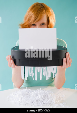 Woman shredding paper Stock Photo: 30683508 - Alamy