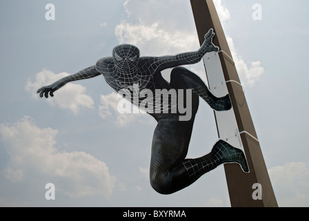 life size advertisement for movie Spider Man on light pole in shopping ...