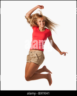 young woman jumping on white background Stock Photo - Alamy