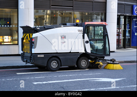 London street cleaner sweep, cleaning streets with brush and spade ...