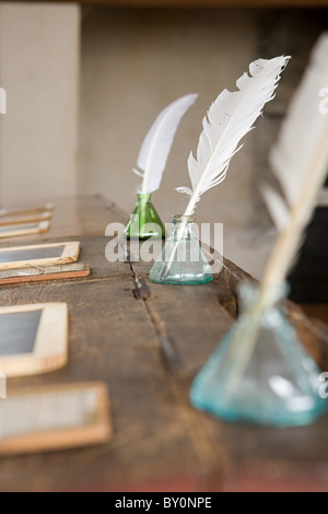 Antique desk with quill pen and papers Stock Photo - Alamy