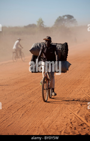 NAMPULA, MOZAMBIQUE, May 2010 : Bringing charcoal to town by bike. A ...