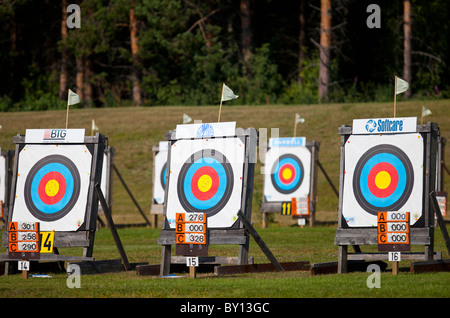 Row of standard FITA archery targets and scoreboards at shooting range ...