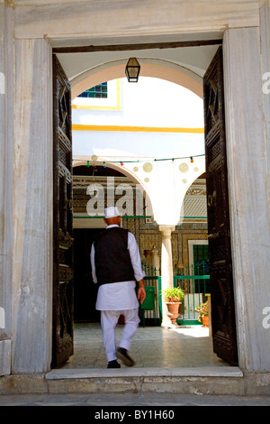 Tripoli, Libya; An elderly Muslim man dressed in white walking to one ...