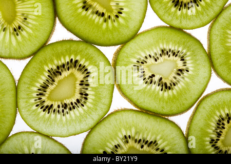 Parts of a kiwi on a white background Stock Photo - Alamy