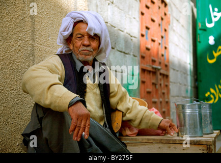 Tripoli, Libya; An elderly Muslim man dressed in white walking to one ...
