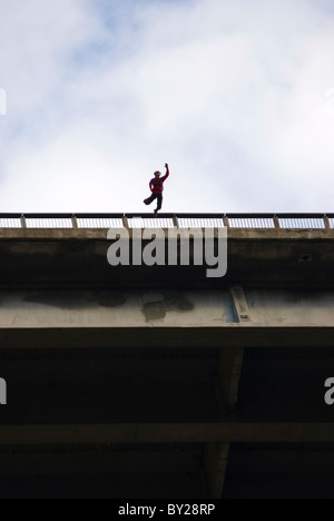 A man jumping off a bridge for a BASE jump Stock Photo - Alamy