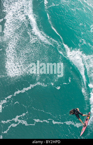 Ariel view of a young man tow Surfing at Phantoms on the north shore of ...