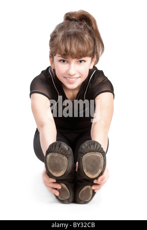 Cute teenage girl stretching. Studio portrait on white background Stock ...