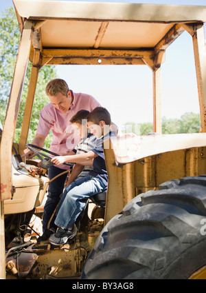 New York, USA, two boys squatting under the Charging Bull Stock Photo ...