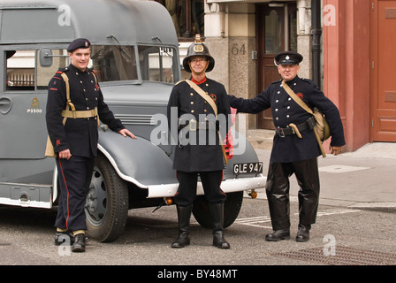 Firefighters dressed in uniforms second world war Austin Fire engine ...