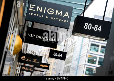 Signs jostle for positions in the city centre of Geneva Stock Photo - Alamy