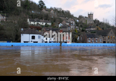Flood defence barriers hold back flood water in Ironbridge, Shropshire ...