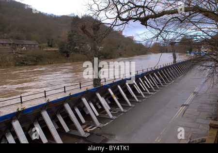 Flood defence barriers hold back flood water in Ironbridge, Shropshire ...
