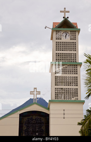 Catholic Church in La Fortuna, Costa Rica, with Arenal Volcano in the ...