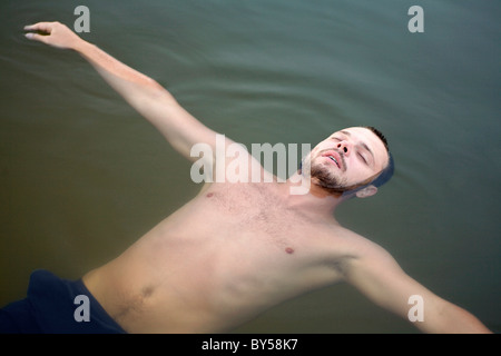 Swimming trunks floating on water surface Stock Photo - Alamy