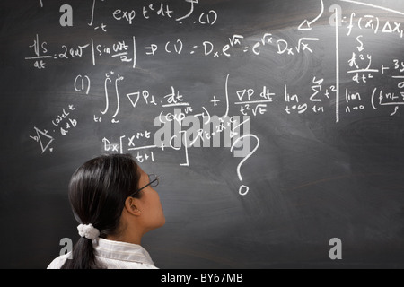 Looking at difficult complex mathematics equation on balckboard Stock ...