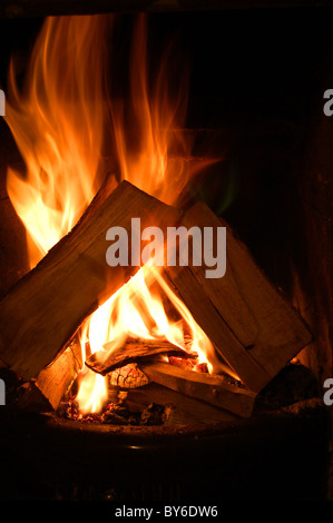 A blazing log fire in an open fireplace Stock Photo - Alamy