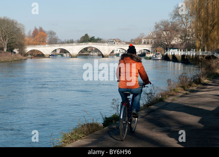 cycling on the thames path in richmond Stock Photo - Alamy