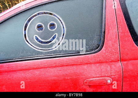 smiley face drawn in frost on car window Stock Photo - Alamy