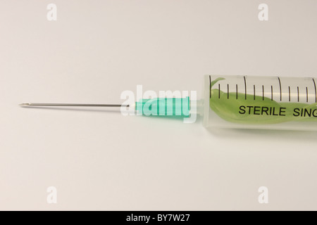 photo syringe with a plant in it on a white background close up Stock ...