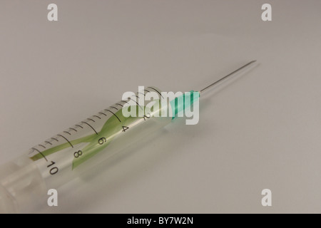 photo syringe with a plant in it on a white background close up Stock ...