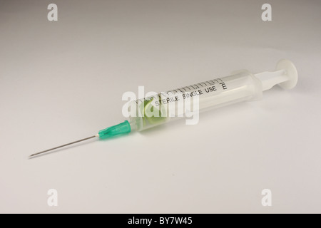 photo syringe with a plant in it on a white background close up Stock ...