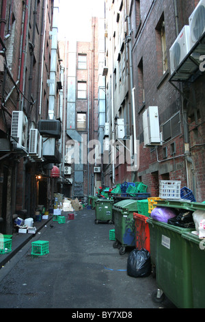 Overflowing recycling bins with garbage scattered around, illustrating ...