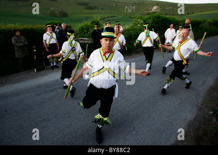 Long Man Morris Men dance at the foot of the Long Man of Wilmington as ...