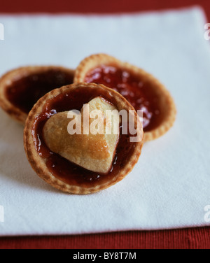 jam tarts with heart shaped pastry lids Stock Photo - Alamy