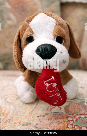 Valentines day heart shaped toy gift and silverware. View from above ...