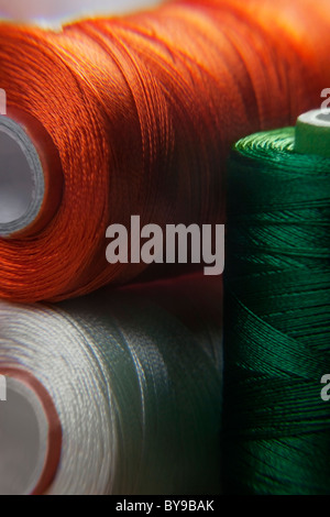 Different coloured spools Stock Photo - Alamy