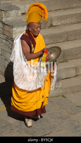 Yellow Hat Buddhist monk plays the conch shell at Naqu traditional ...