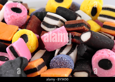Pink and orange coloured liquorice allsorts, invented by Basset's. Also ...