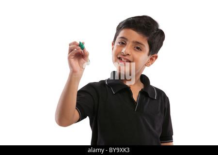 Young boy holding a marker pen Stock Photo - Alamy