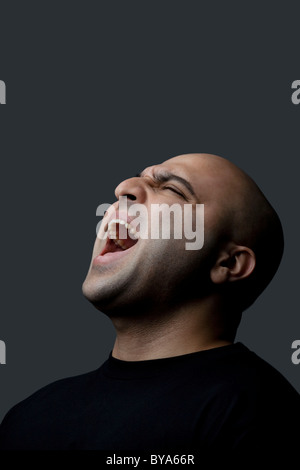 Bald man screaming Stock Photo - Alamy