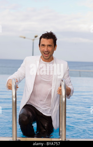 Stepping into Pool Stock Photo - Alamy