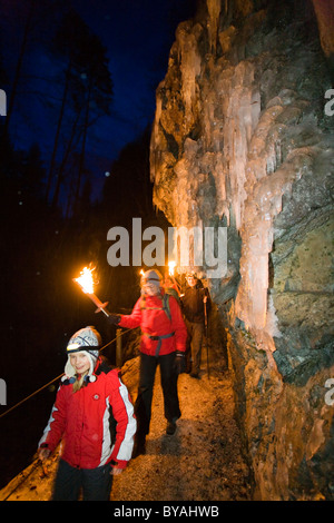Hiking with torches in the Partnachklamm gorge near Garmisch ...