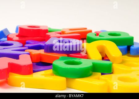 Colorful magnetic letters spelling the words Education, Reading ...