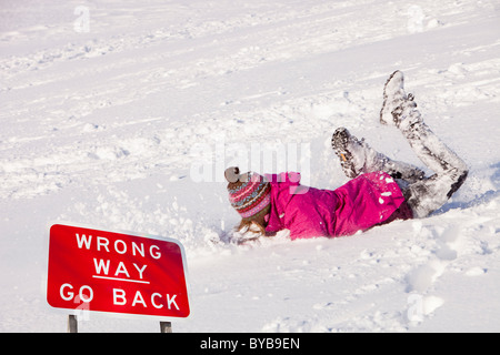 A young girl falling over in snow, Settle, UK Stock Photo - Alamy